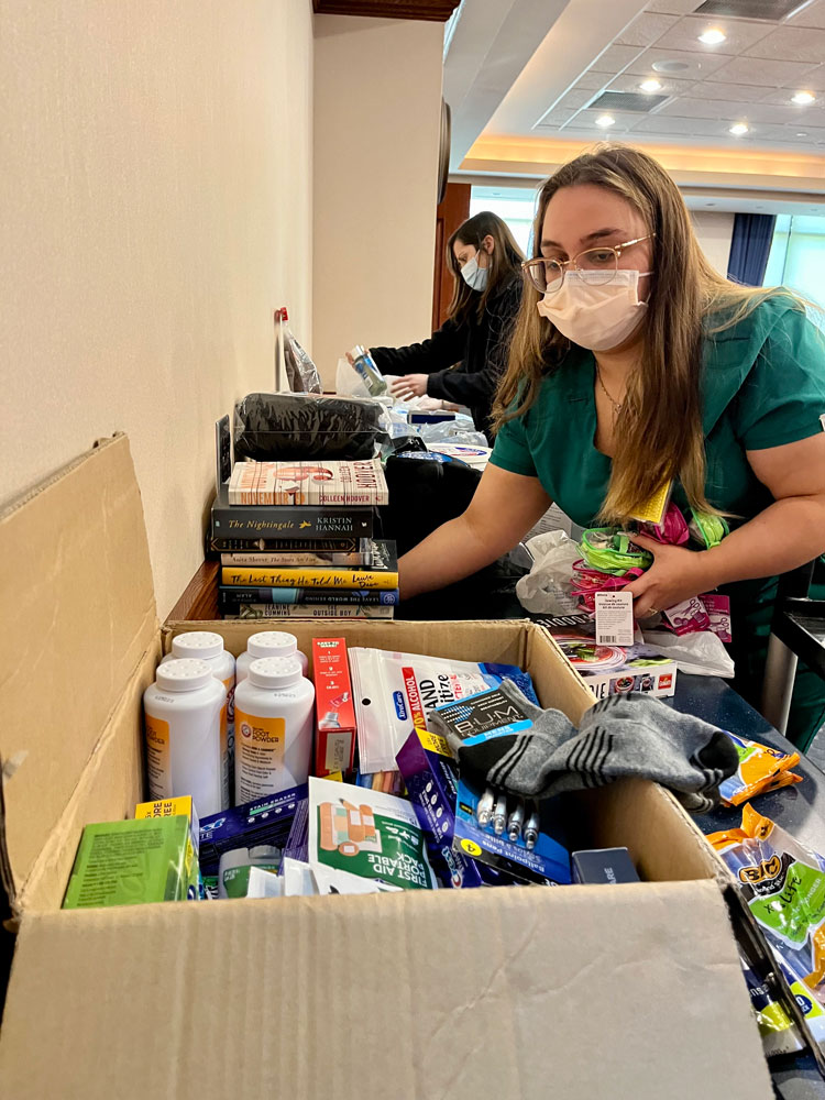 St Mary Medical Centers Give Back Committee packs donations for ...